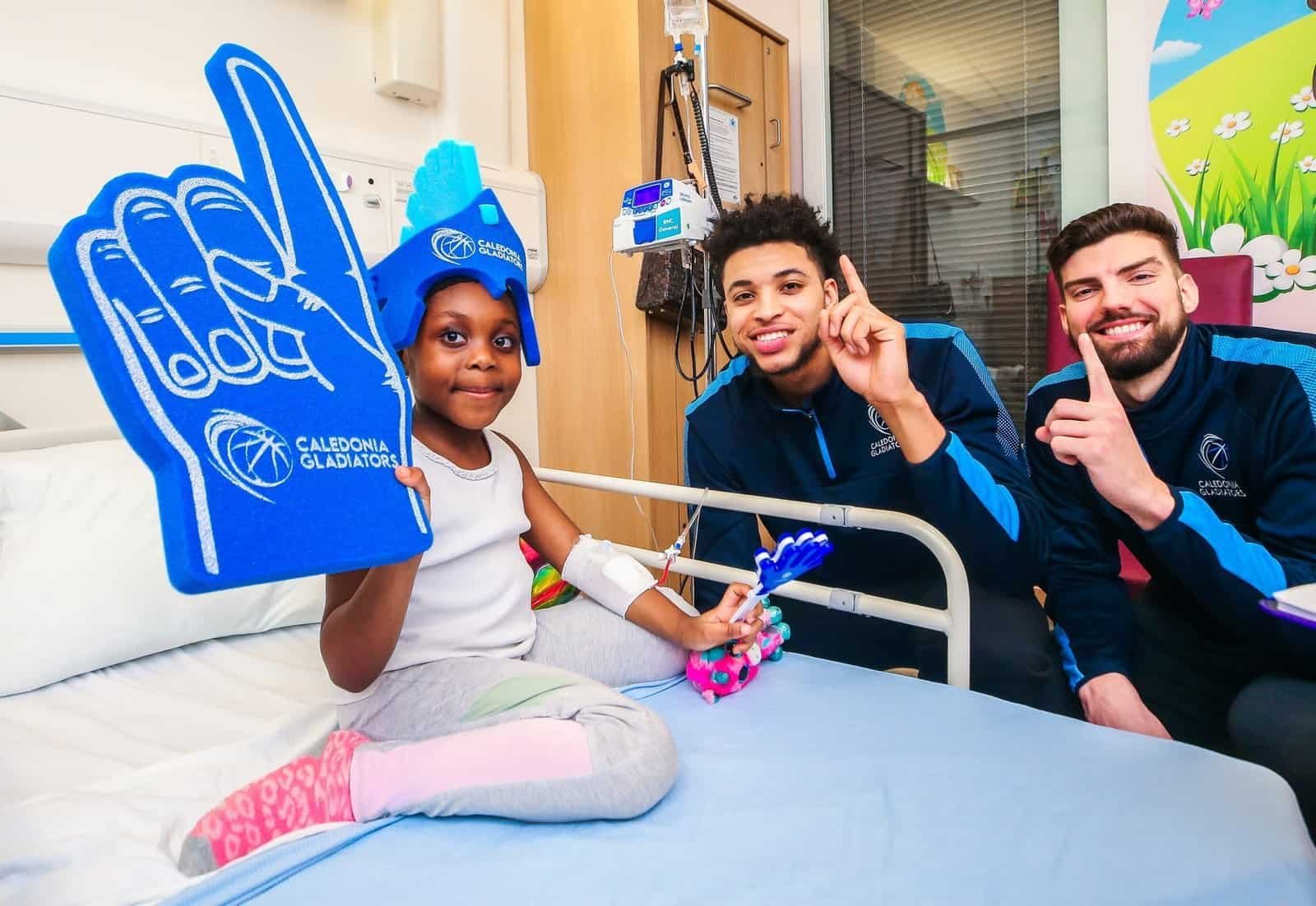 Santa’s tallest little helpers spread festive cheer in children’s ...